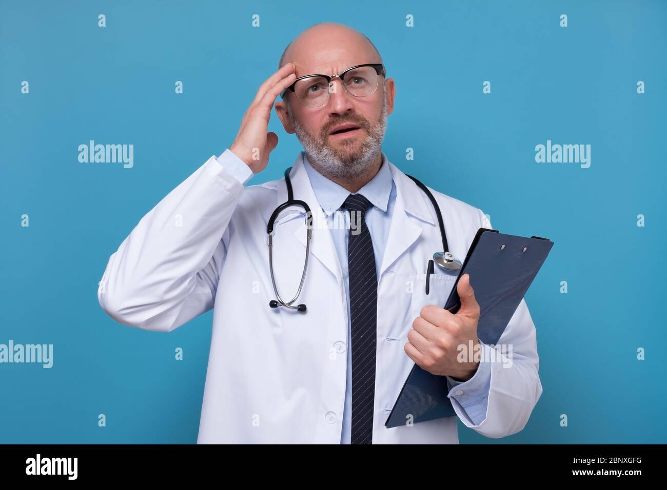 Doctor thinking about diagnosis being confused with medical exam ...