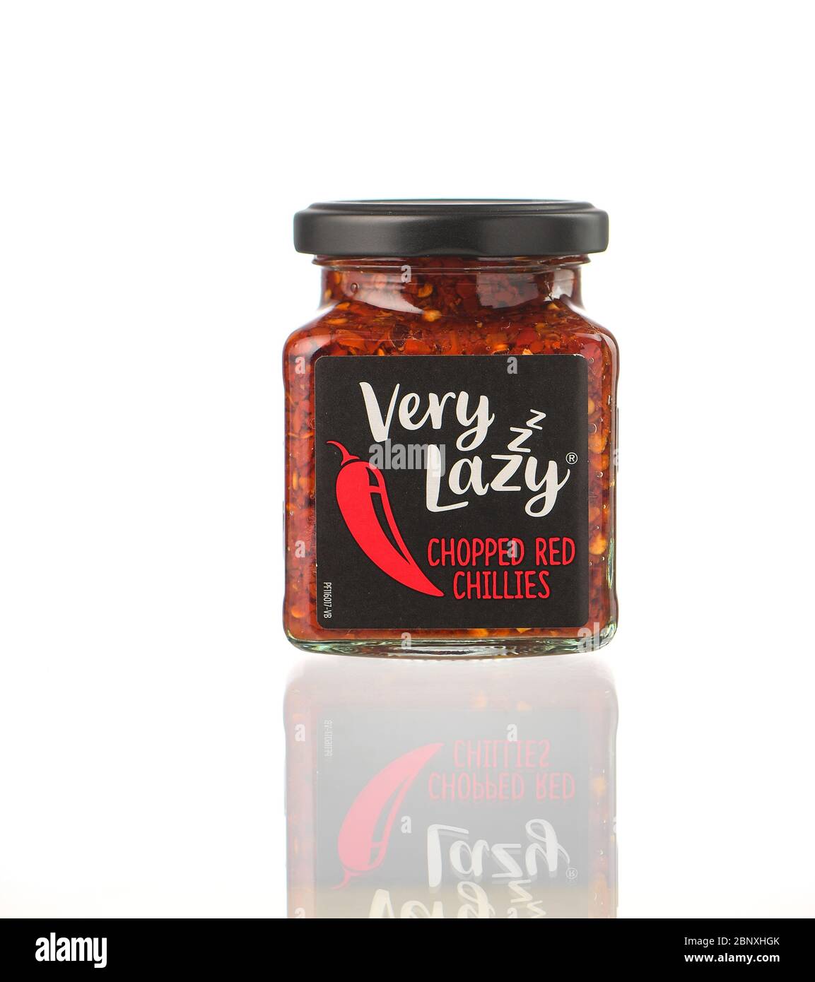 Very lazy brand of chopped red chillies in a jar isolated against a ...