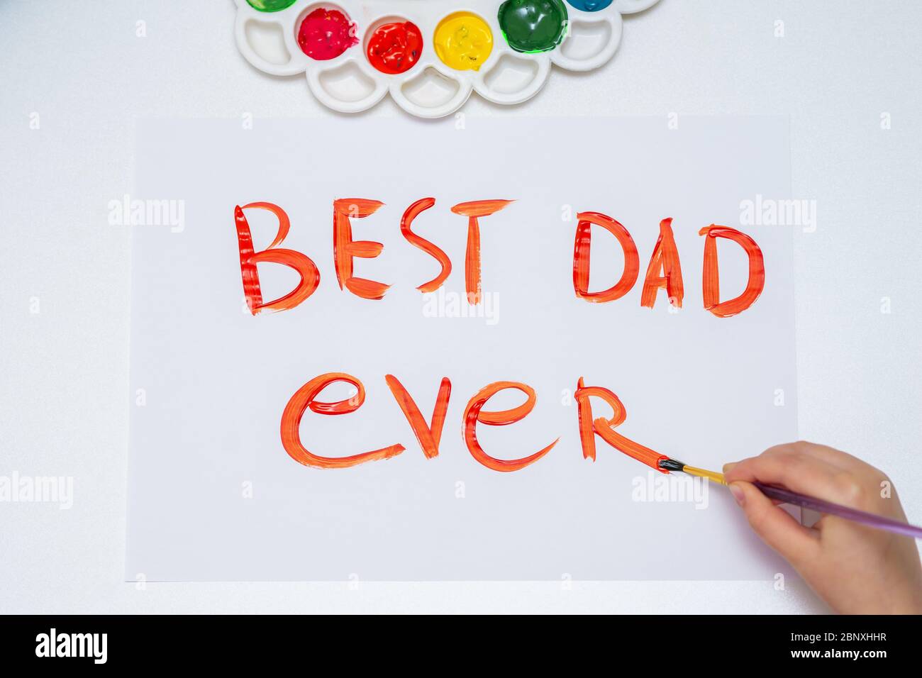 Top view of child's hand drawing handwritten text Best Dad Ever on ...