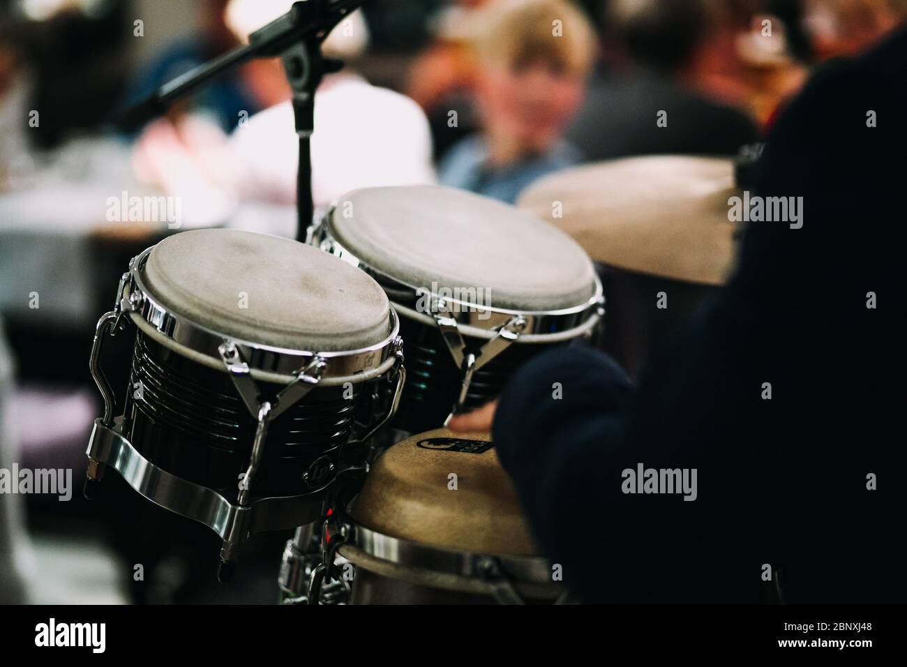 photo of a man playing on drums Stock Photo - Alamy