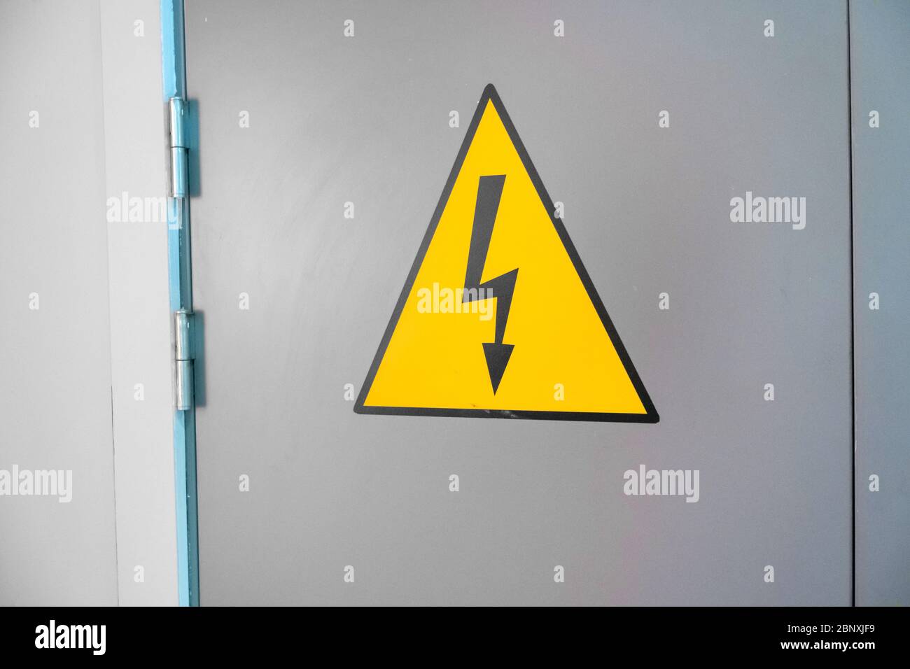 High voltage sign on metal door. Close up Stock Photo - Alamy