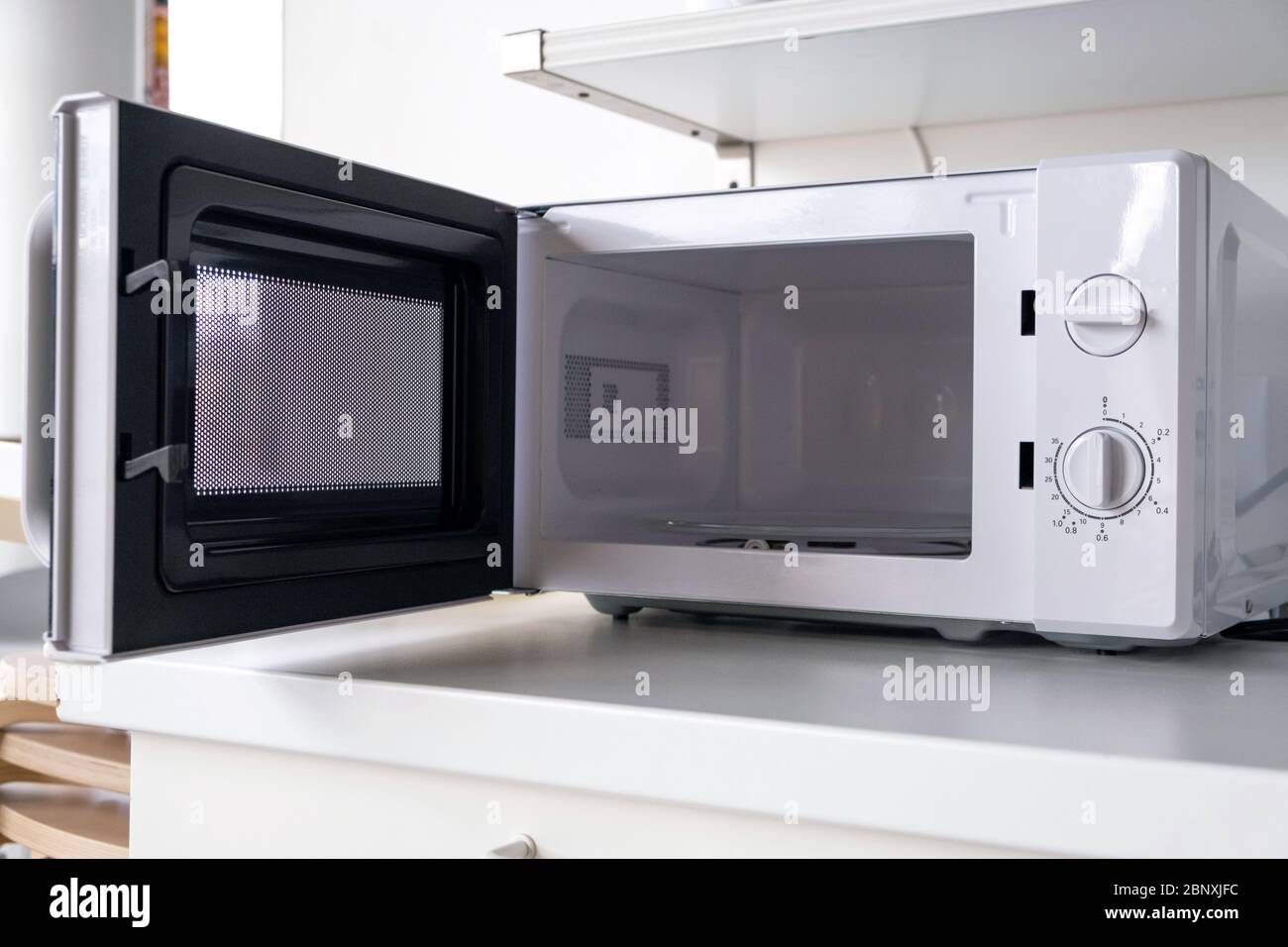 Microwave oven in fast food shop and restaurant. Close up Stock Photo ...