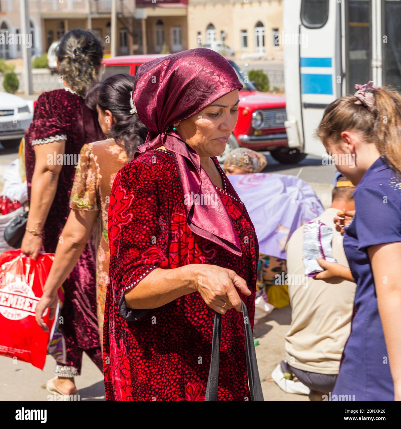 SAMARKAND, UZBEKISTAN - AUGUST 29, 2016: a woman goes shopping at the ...