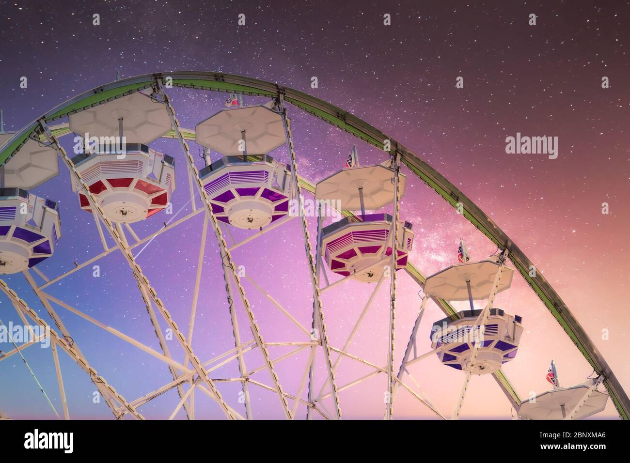 A ferris wheel that appears to be in a galaxy in outer space Stock ...