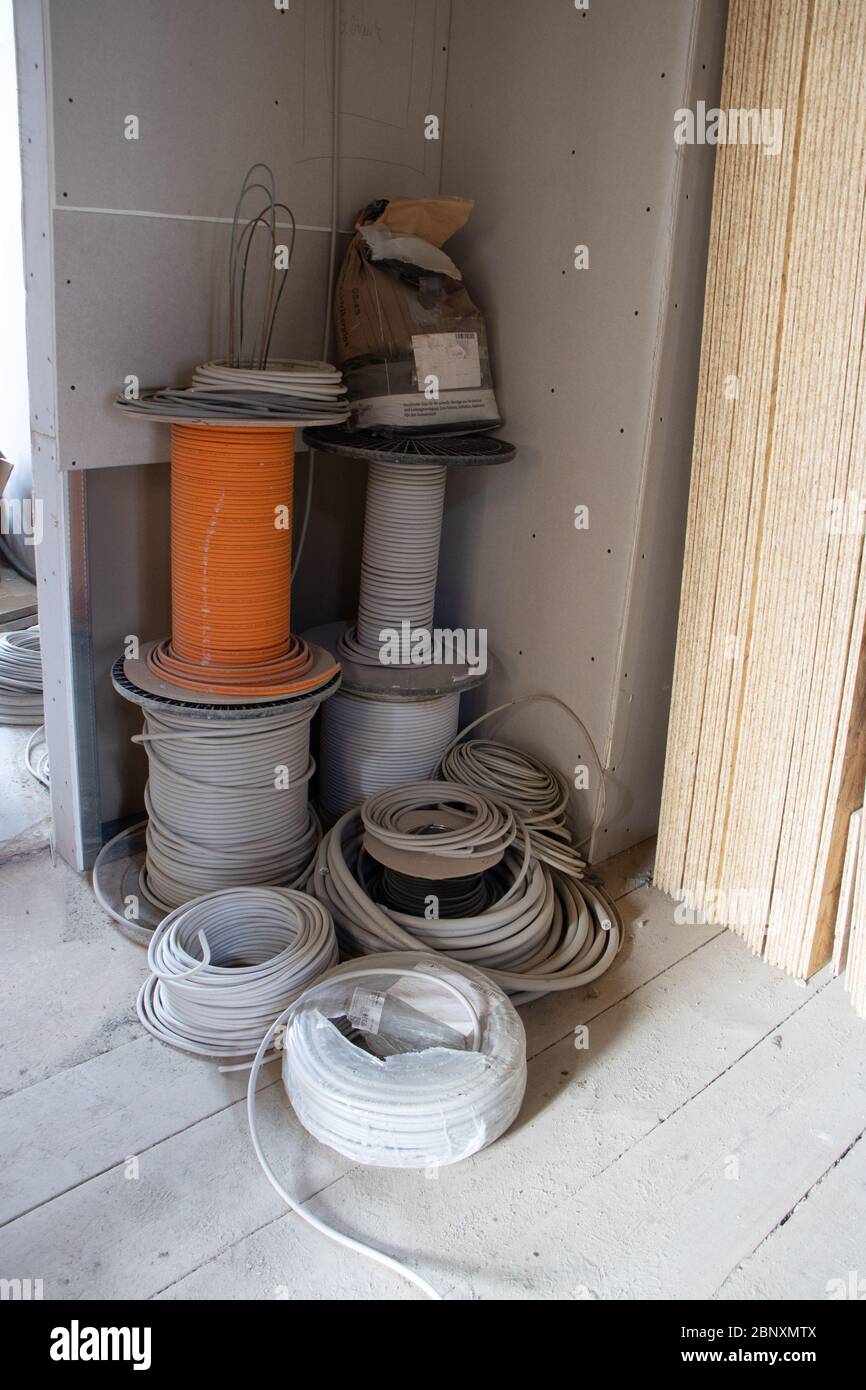 on a construction site there are many electric cables in one corner ...