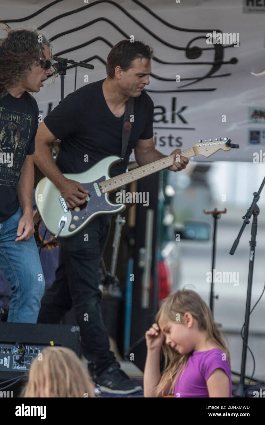 Rock and roll band's lead guitar, performing at outdoor concert Stock ...