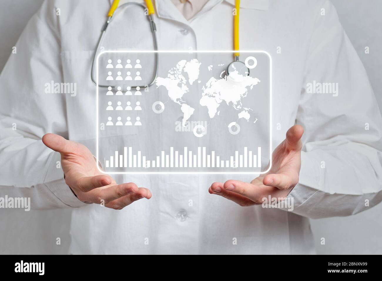 A male doctor abstractly holds graphics with a world map and medical ...