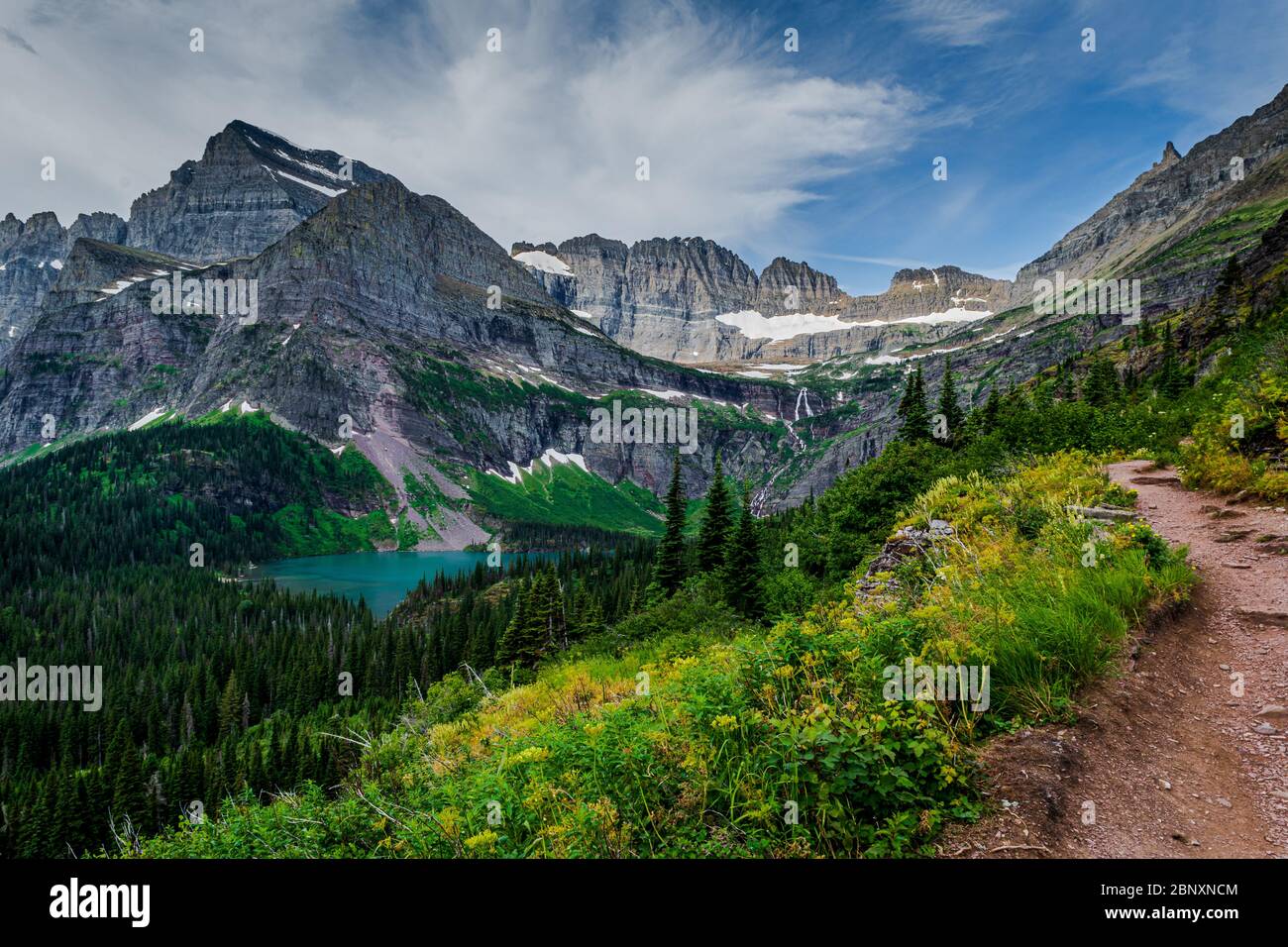 Turquoise blue Lower Grinnell Lake comes into view along the Grinnell ...