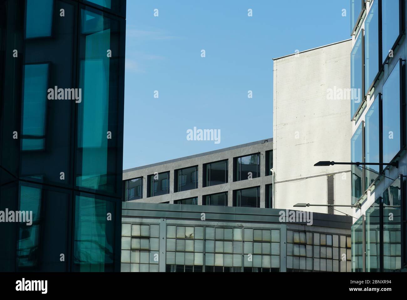 a scene from a business space, several corporate buildings standing ...