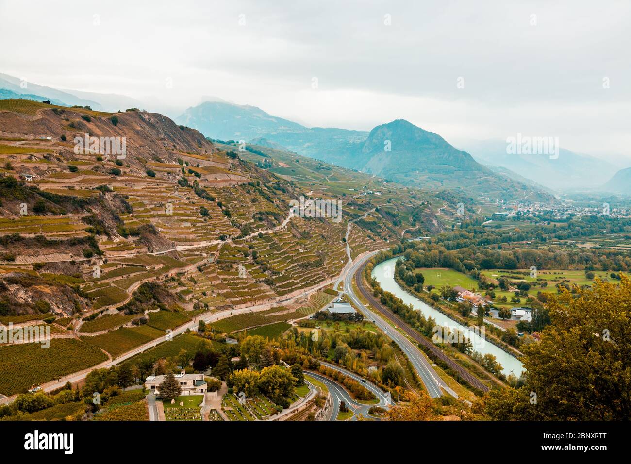 Sion, Switzerland: The valley of the Rhone river and vineyards seen ...