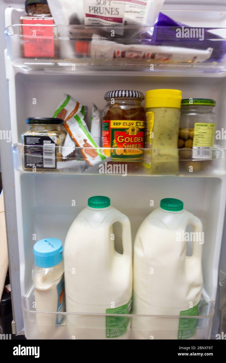 inside a tightly packed small fridge door Stock Photo - Alamy