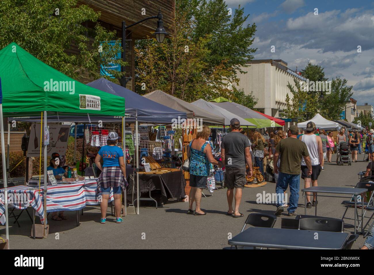 People shopping at outdoor farmers market, on a suny day Stock Photo ...