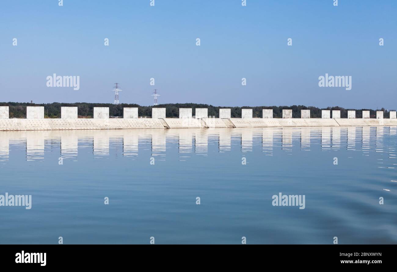 Coastal protective construction made of white concrete blocks. Danube ...