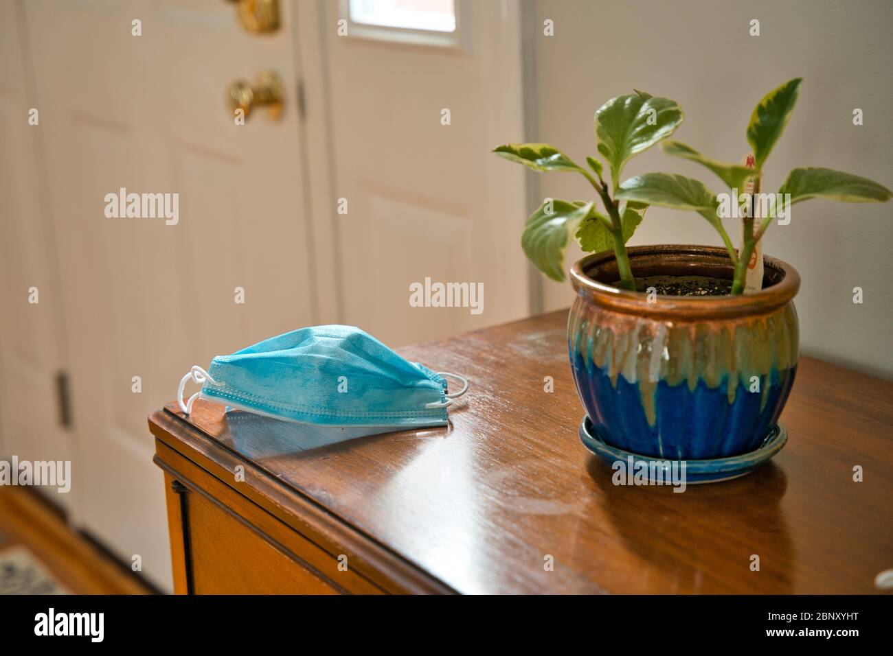 Mask on table looking towards door. Using mask as protecting from ...