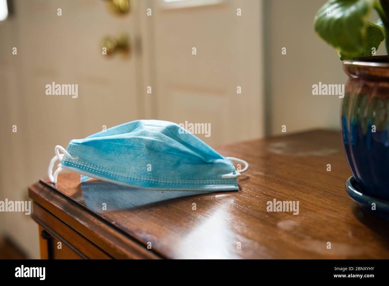 Mask on table looking towards door. Using mask as protecting from ...