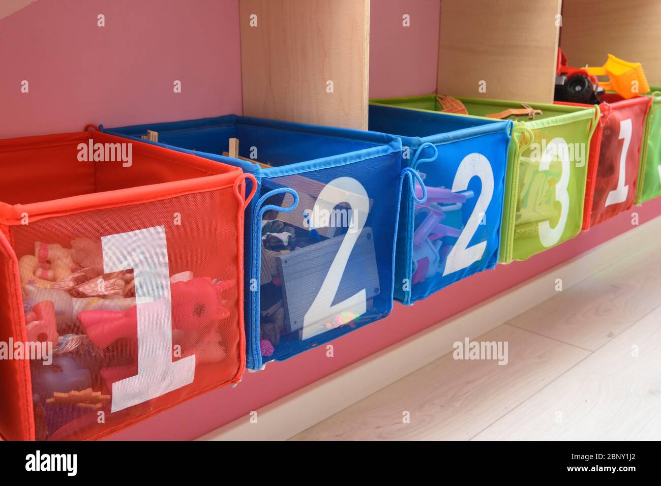 multi-colored boxes with numbers filled with little things Stock Photo ...