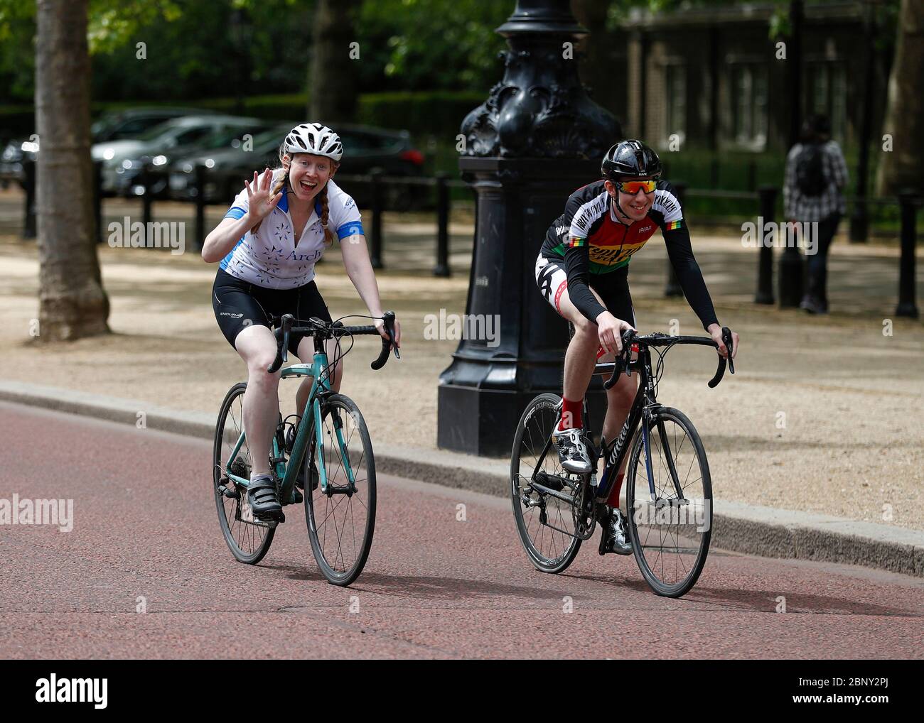 London, UK. 16th May, 2020. Cyclists cycling towards Buckingham Palace ...
