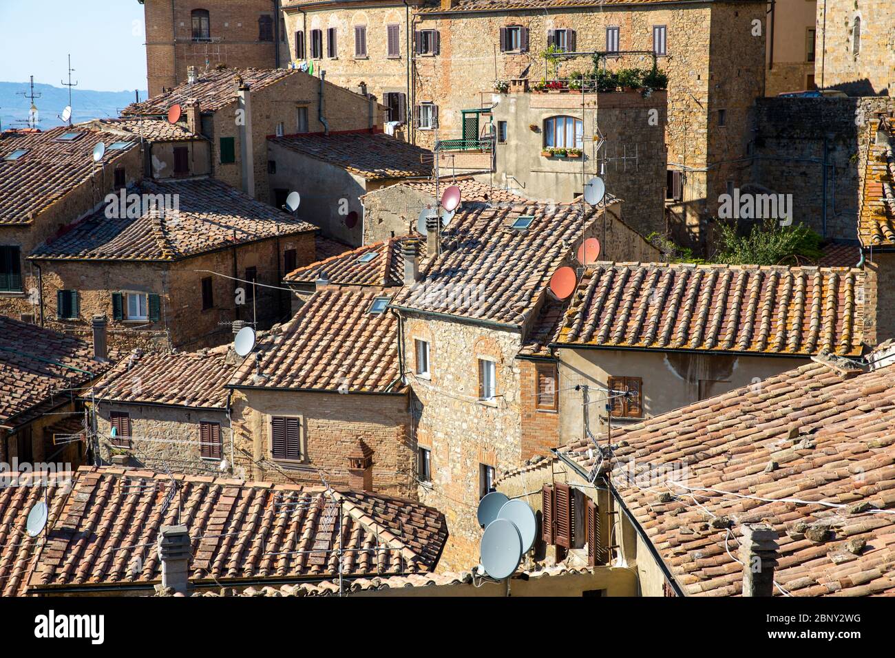 Volterra italian medieval town with rooftops and view of val di cecina ...