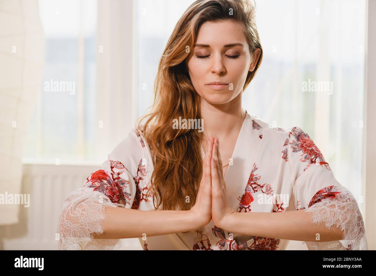 Close up yoga pose with hands position of palms folded together, woman ...