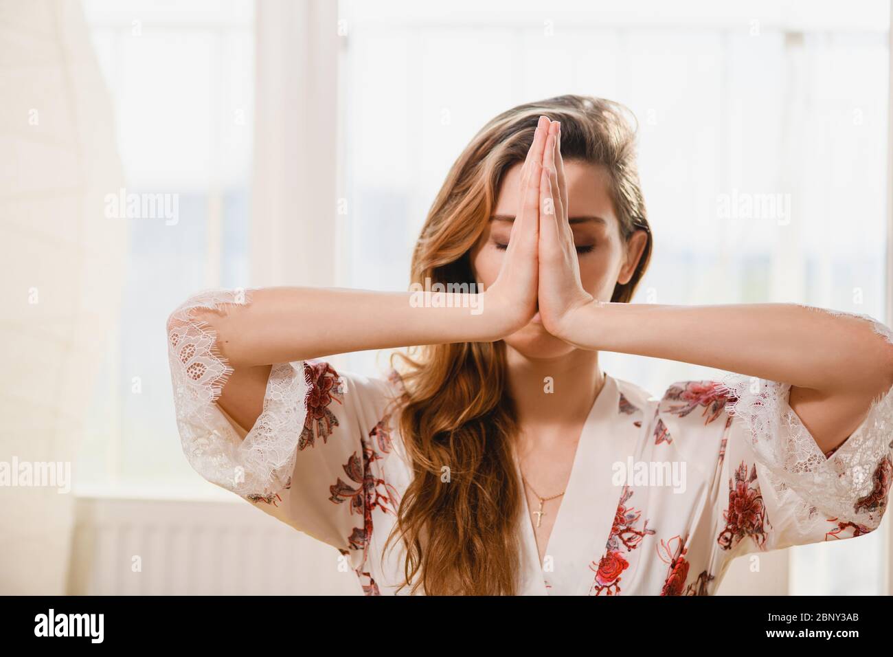 Close up yoga pose with hands position of palms folded together, woman ...