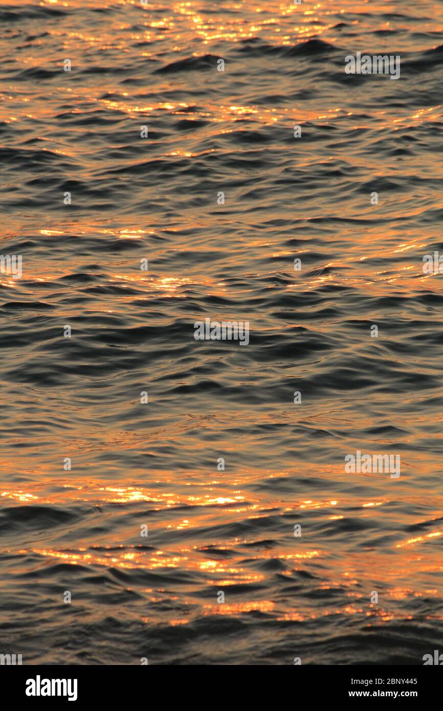 Ocean waves lit sunset hi-res stock photography and images - Alamy