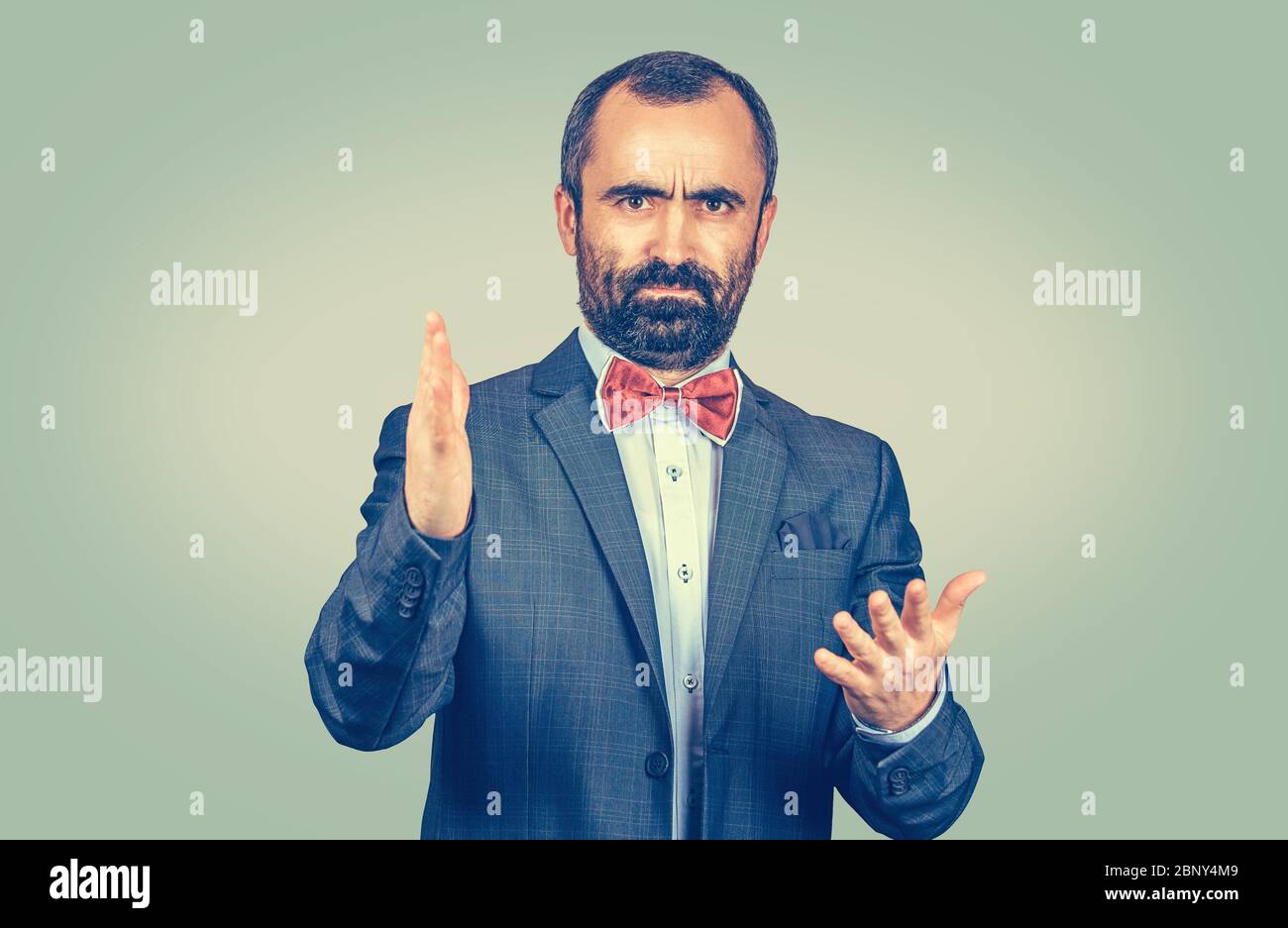 Angry young business man screaming hands in air in frustration looking ...