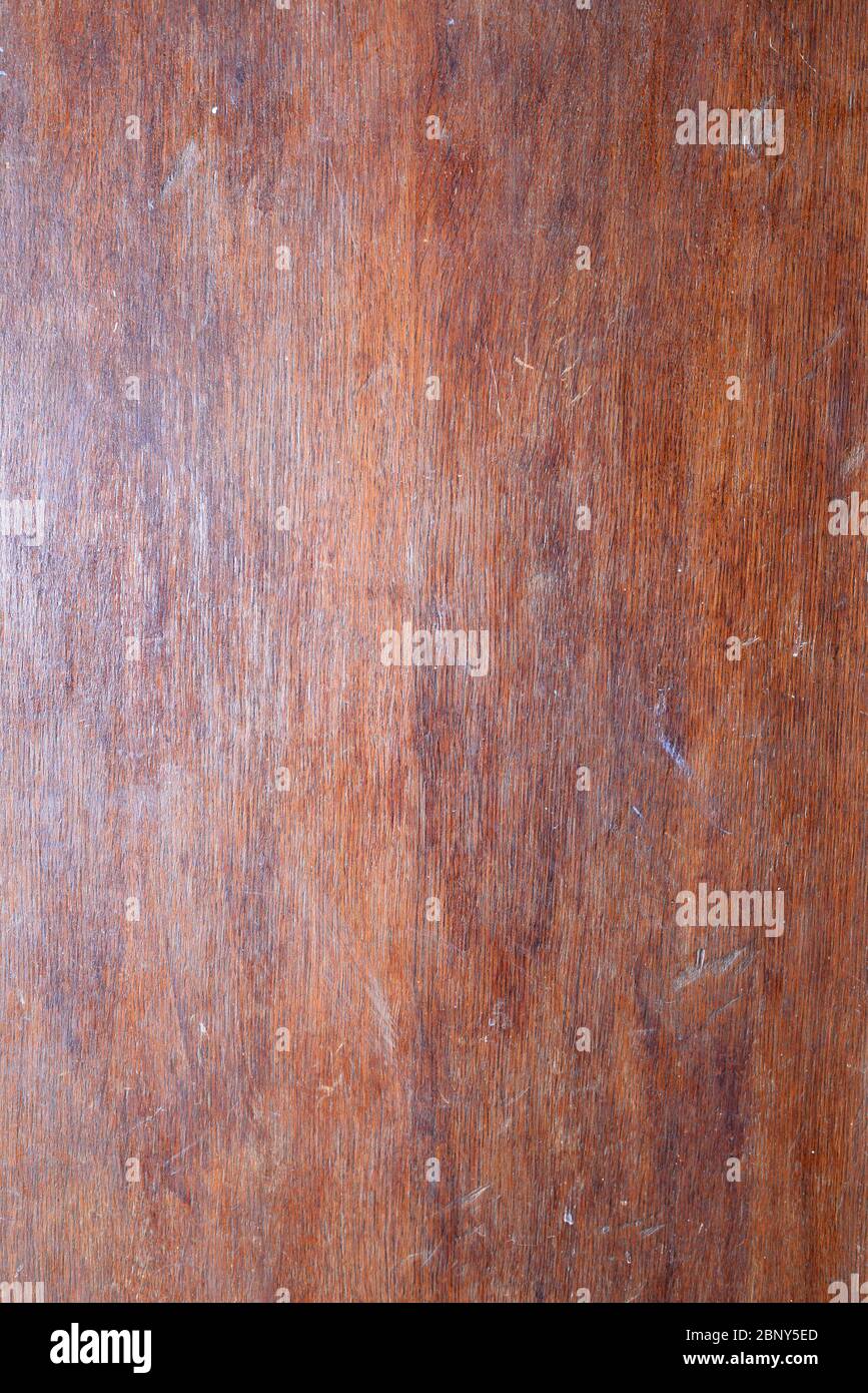 Background. Brown wooden lacquered Board with a glare from the light ...