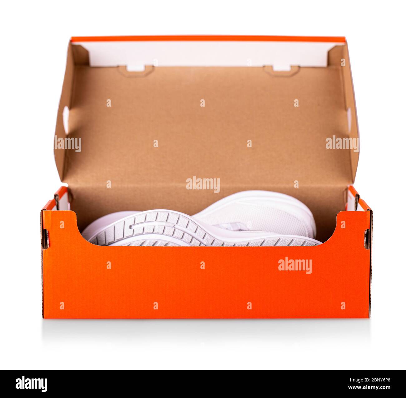 New white sneakers shoes in red box. Taken at studio and isolated over ...