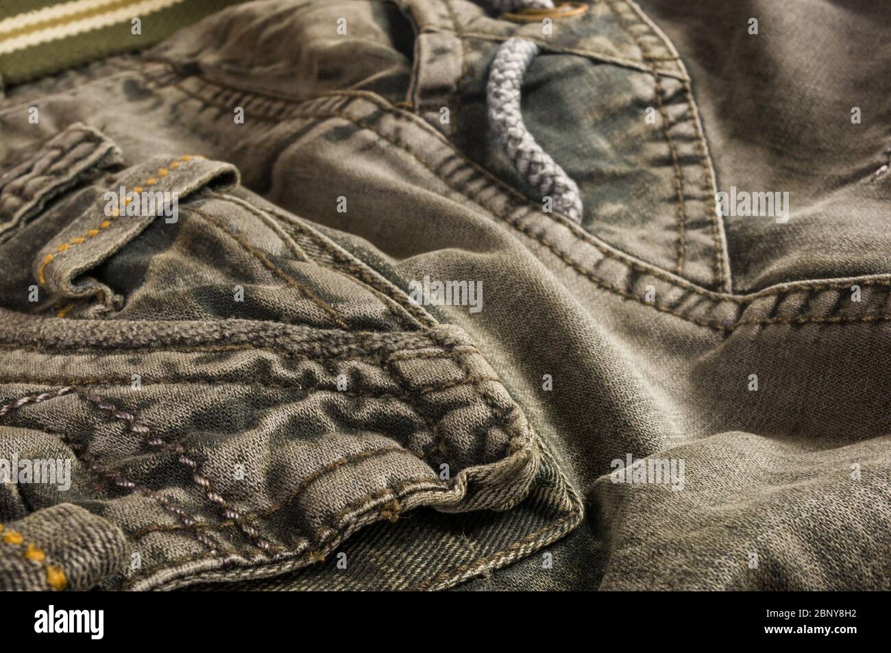 clothing items stonewashed cotton fabric texture with seams, clasps ...