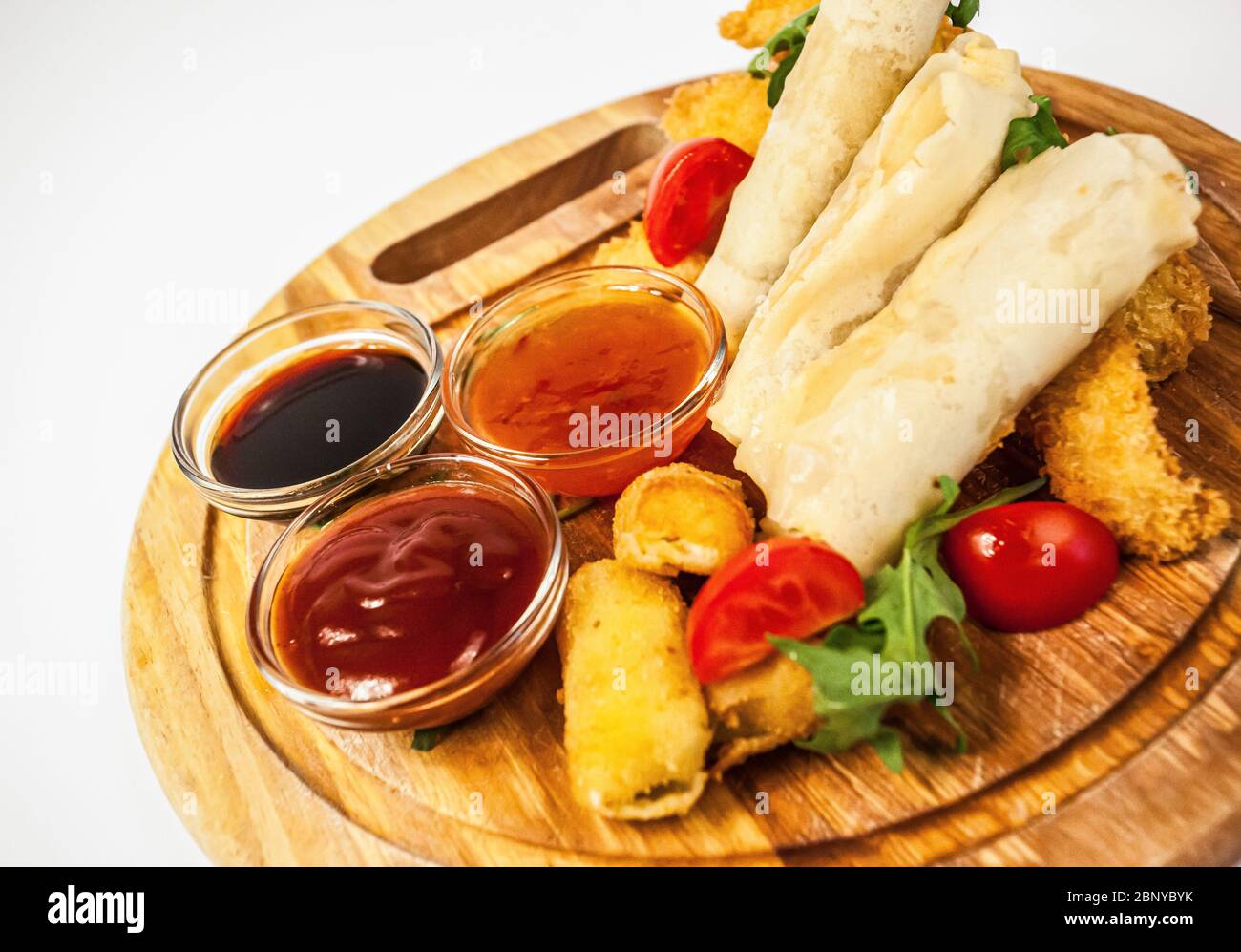 Fresh Spring Rolls with breaded fried cheese and spicy sauces Stock ...