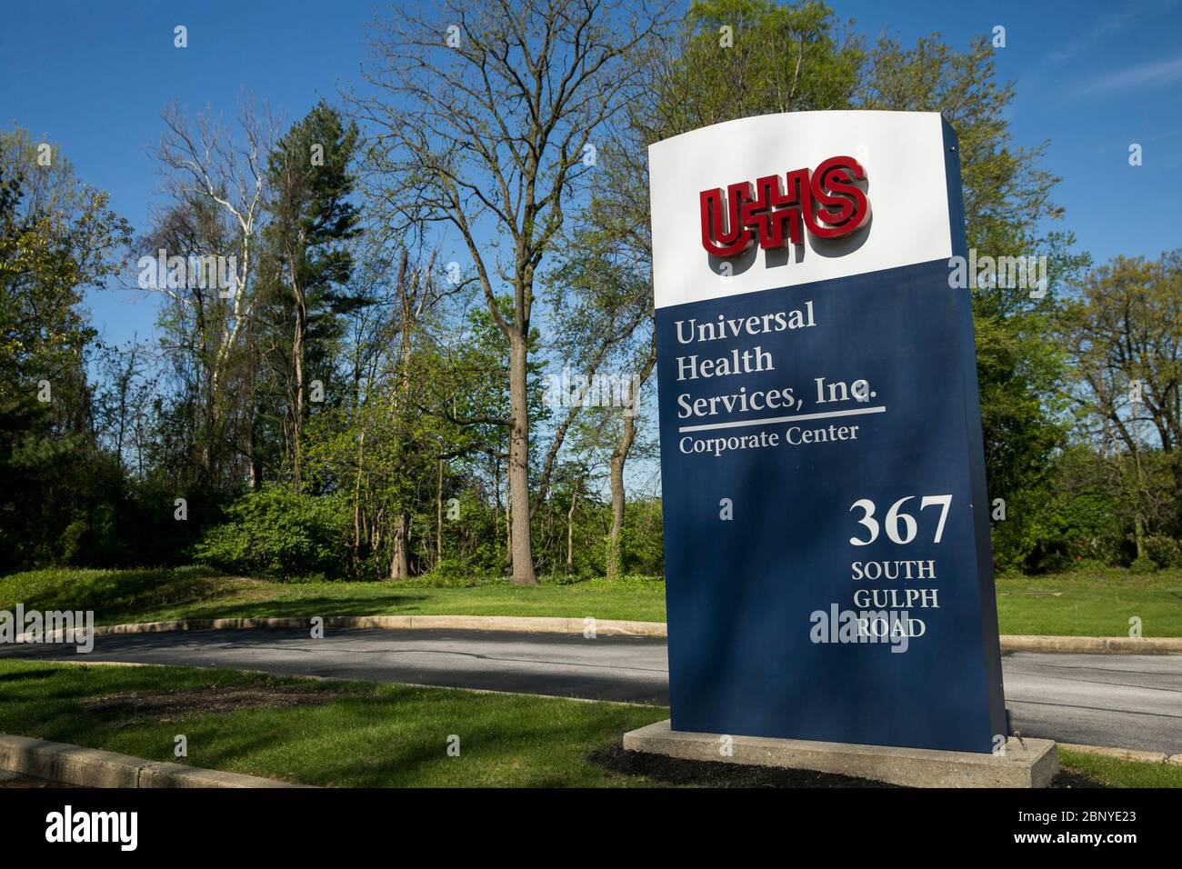 A logo sign outside of the headquarters of Universal Health Services ...