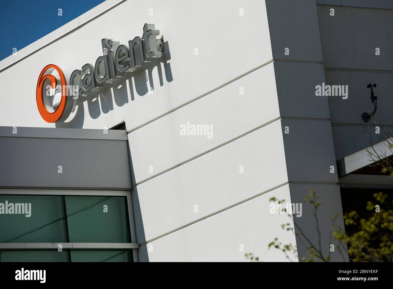 A logo sign outside of a facility occupied by Cadient Group in Malvern ...