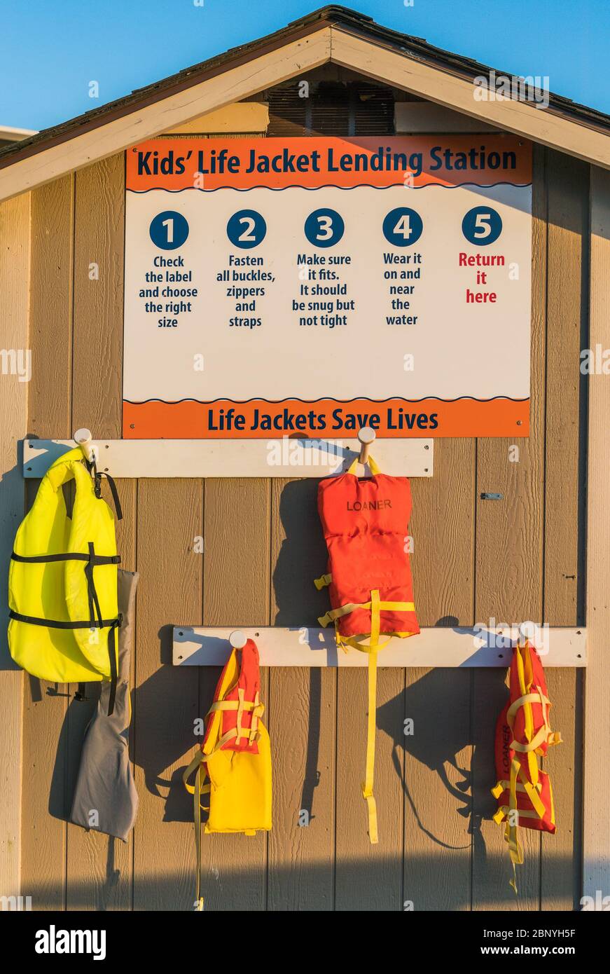 life jacket hang on the wall with sunset and copy space Stock Photo - Alamy