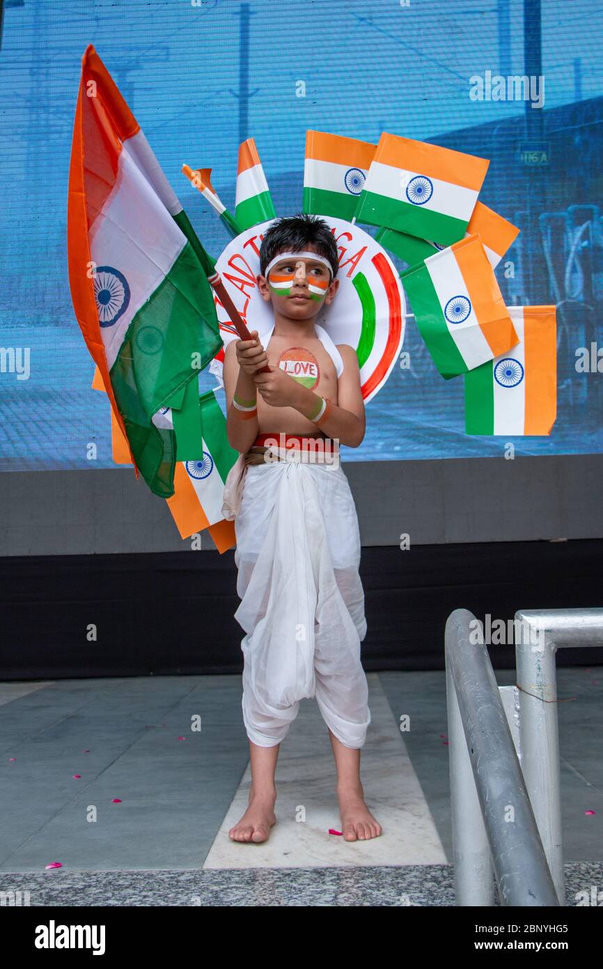 Indian kid waving the national flag at the stage Stock Photo - Alamy