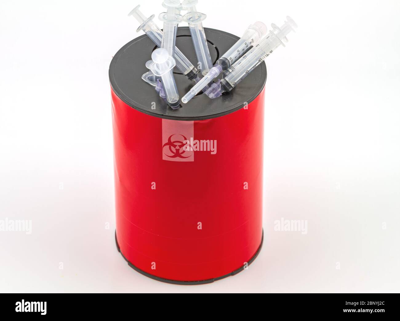 Many syringe in red disposal boxes on white background Stock Photo - Alamy