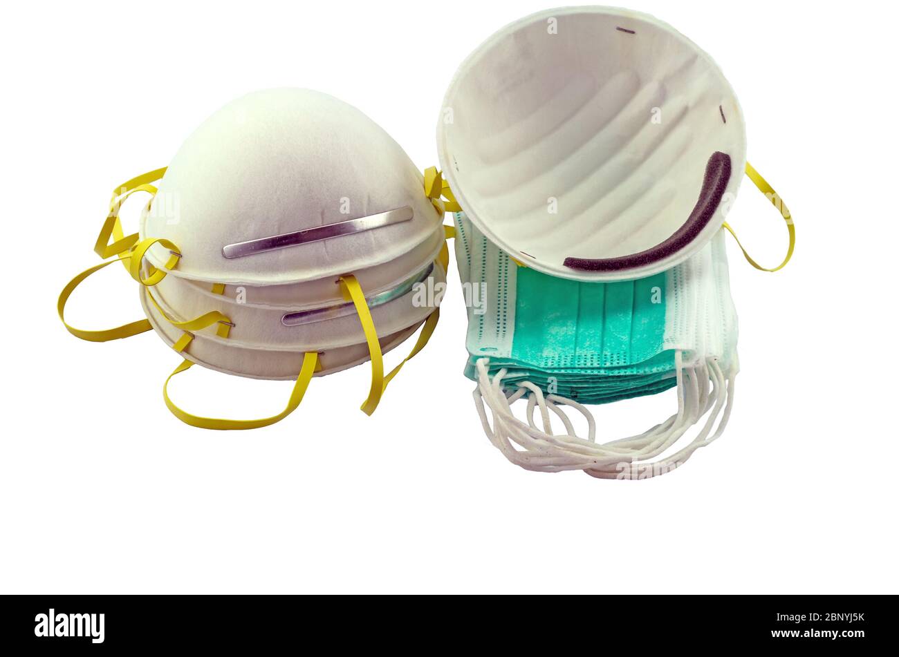 Close up of white mask and blue surgical mask stack on white background ...