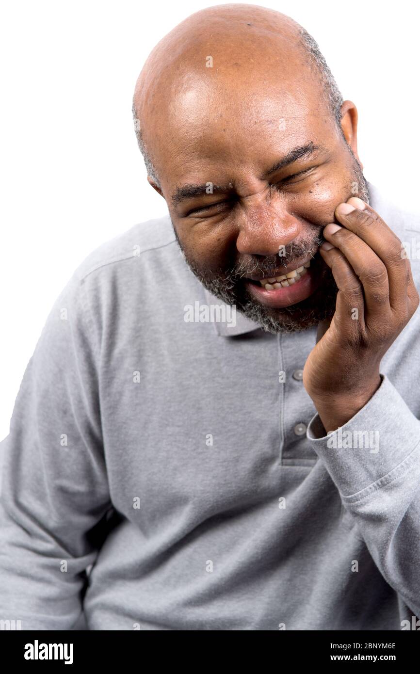 African American Man having tooth ache touching cheek. Senior with ...
