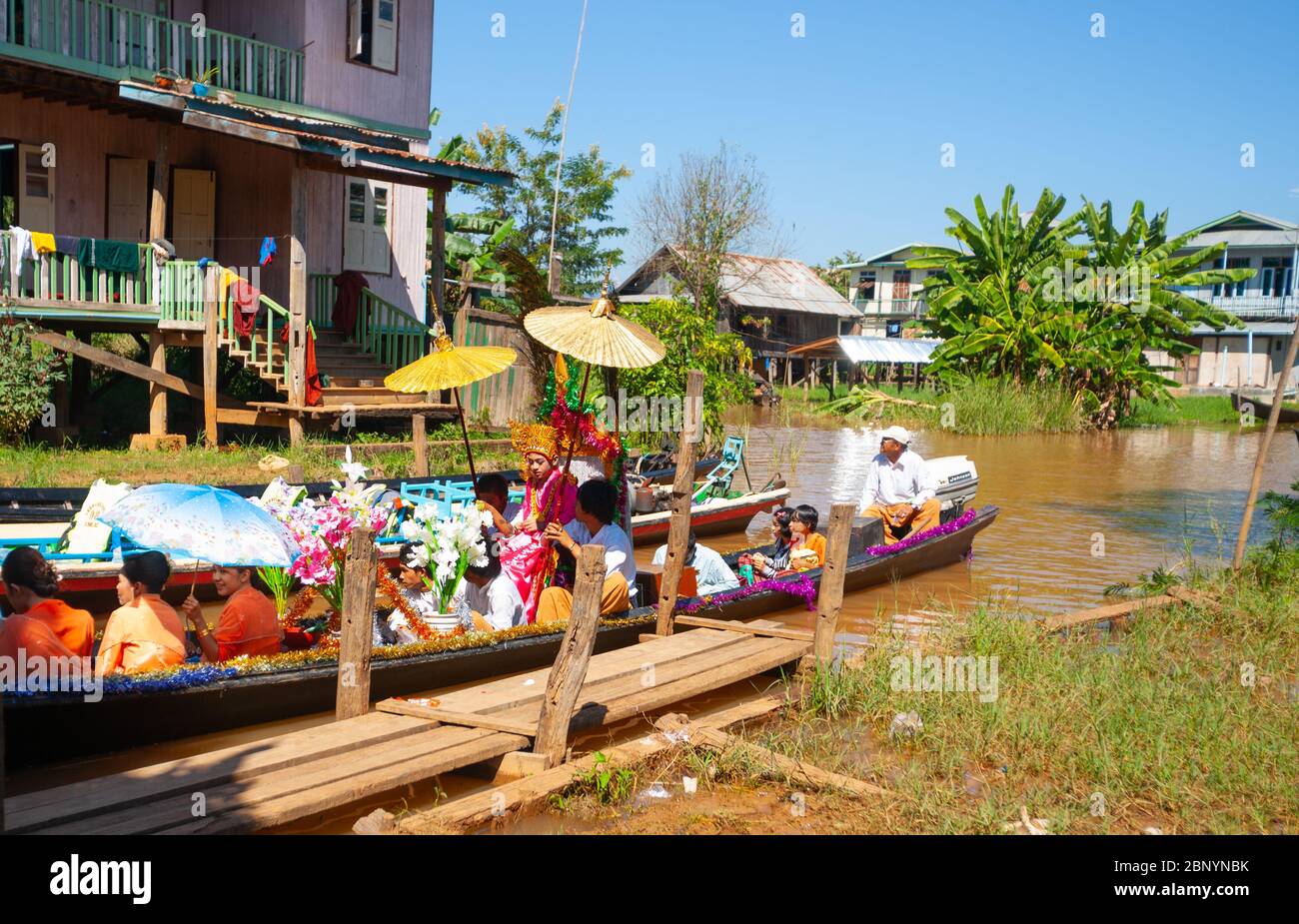 Inle Lake Myanmar - November 3 2013; Family and friends arrive by boat ...