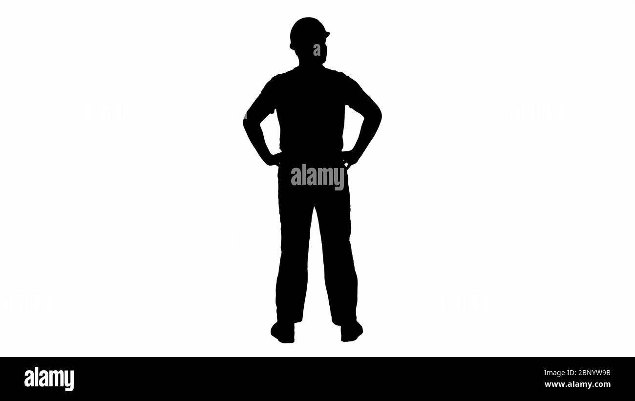 Silhouette Engineer in construction helmet standing with hands on hips ...