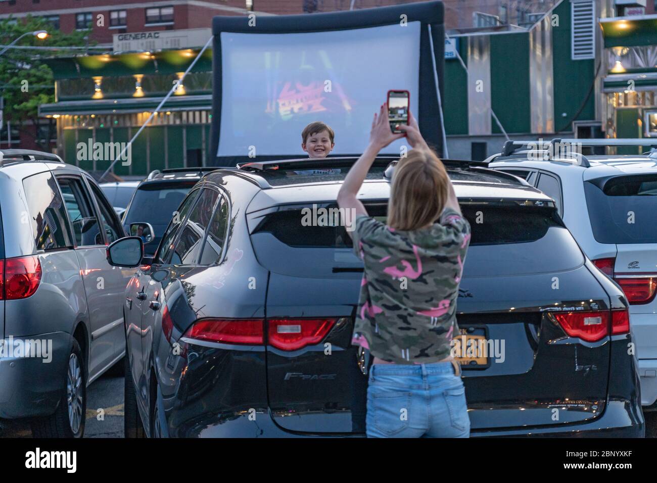 NEW YORK, NY - MAY 16, 2020: A kid poses to his mom during a pop-up ...