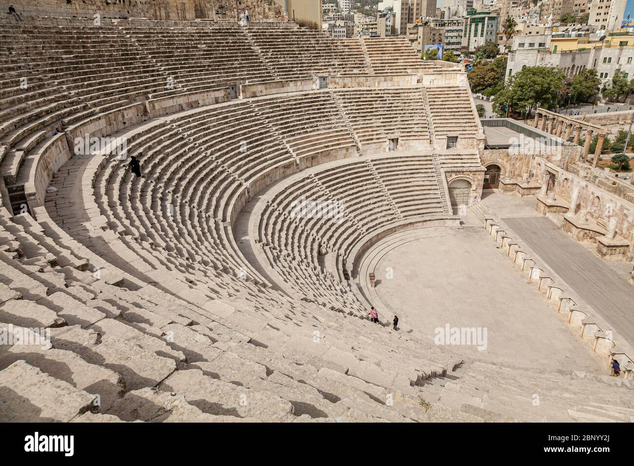 View of the ruins of an ancient Roman amphitheatre in the city of Amman ...