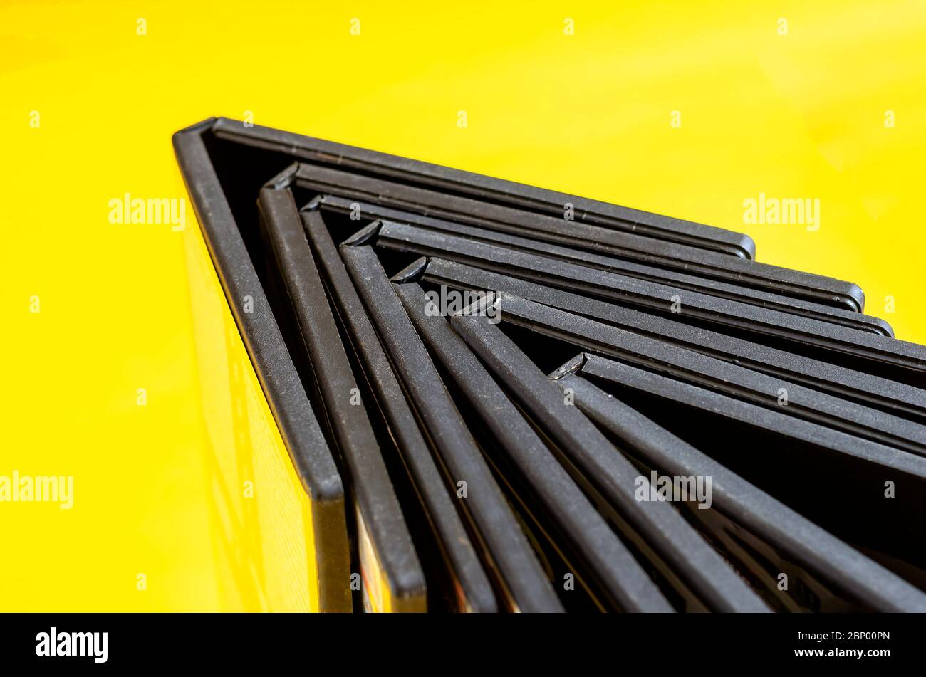 Black disk boxes in the shape of an arrow on a yellow background. Set ...