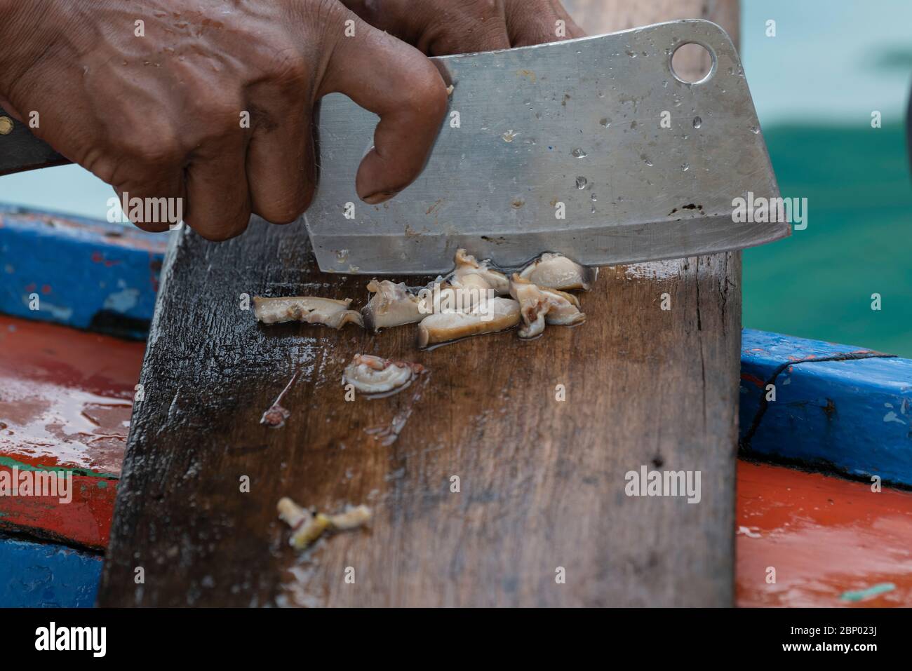 Indigenous people cooking fresh seafood on boat Stock Photo - Alamy