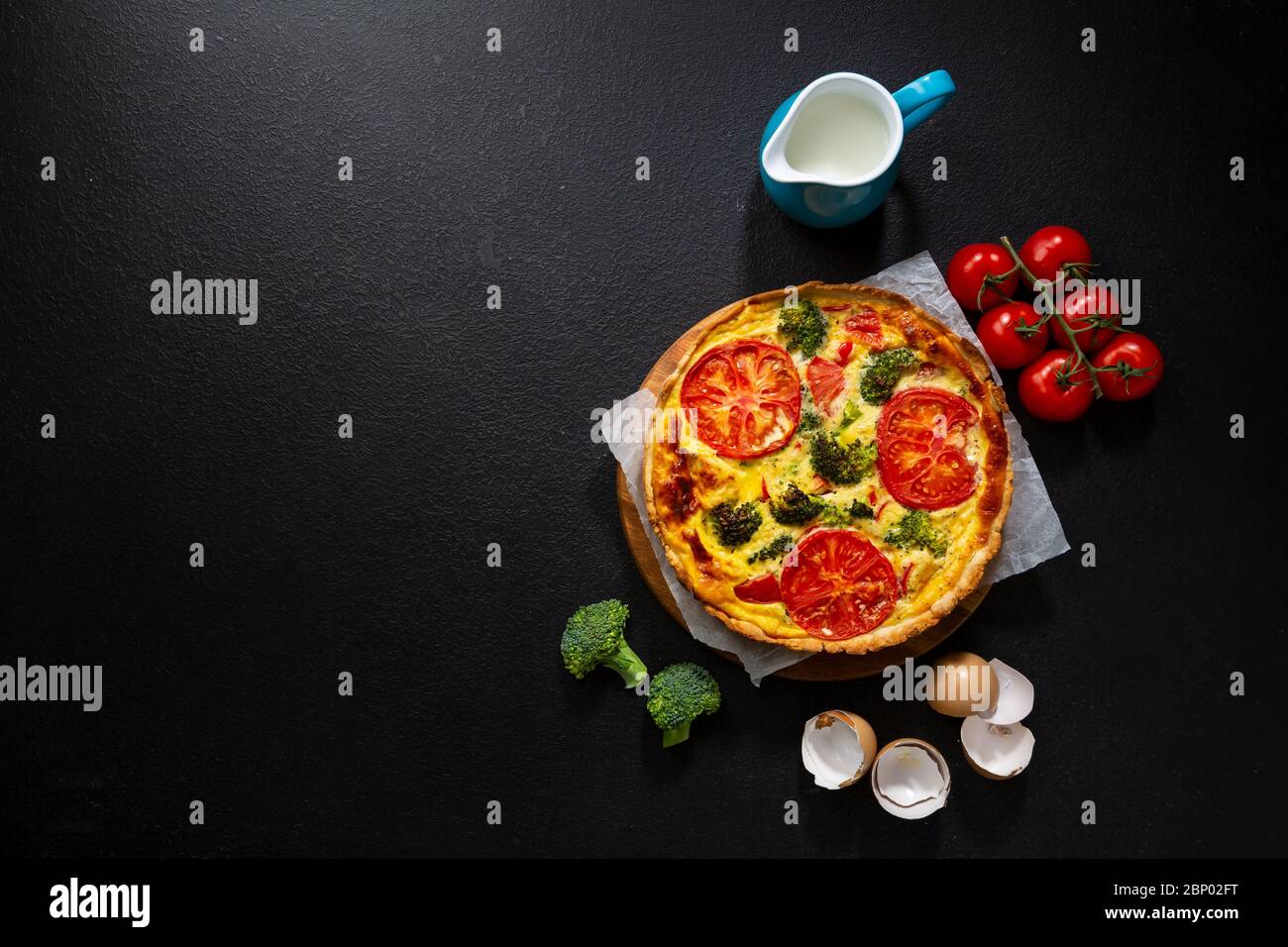 Tomato and broccoli pie overhead view Stock Photo - Alamy