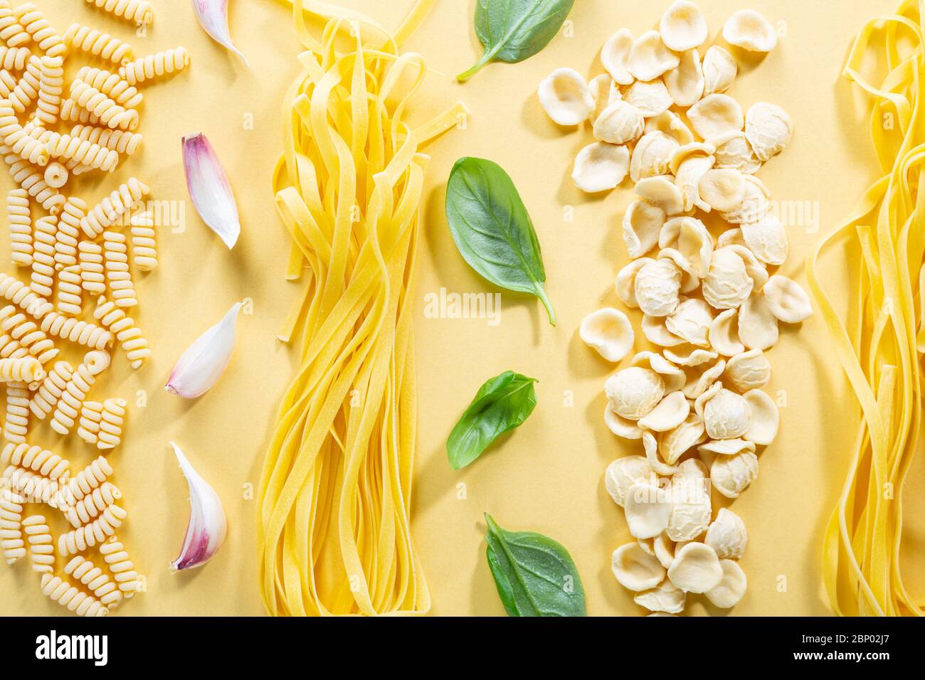 Raw italian pasta food background Stock Photo - Alamy