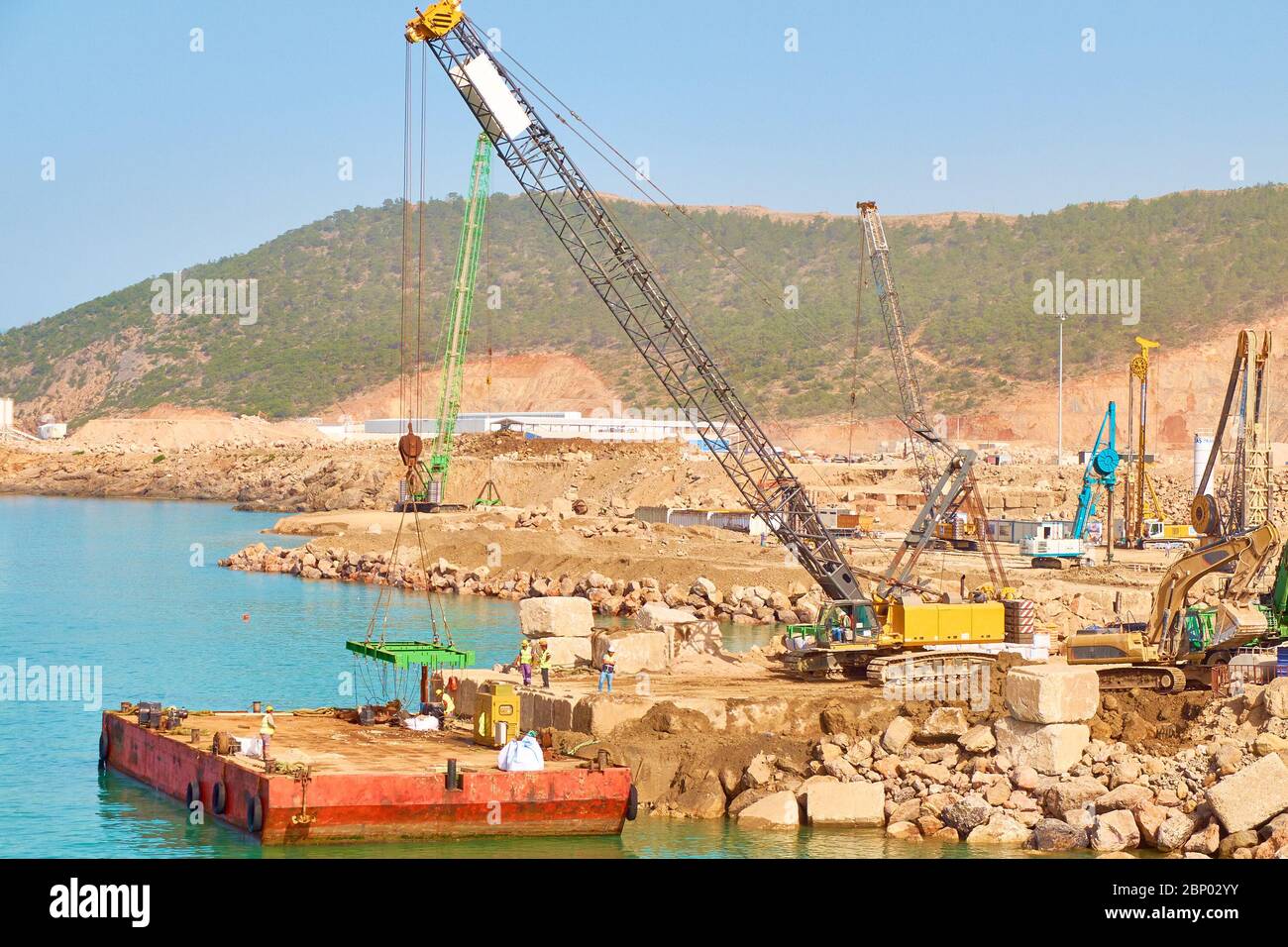 floating platform and lifting machinery on the construction site in the ...