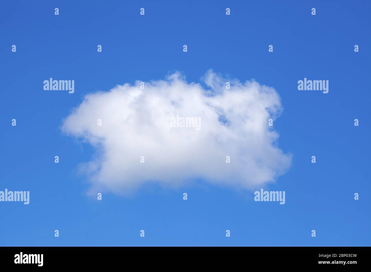 Single white cloud on a blue sky background Stock Photo - Alamy