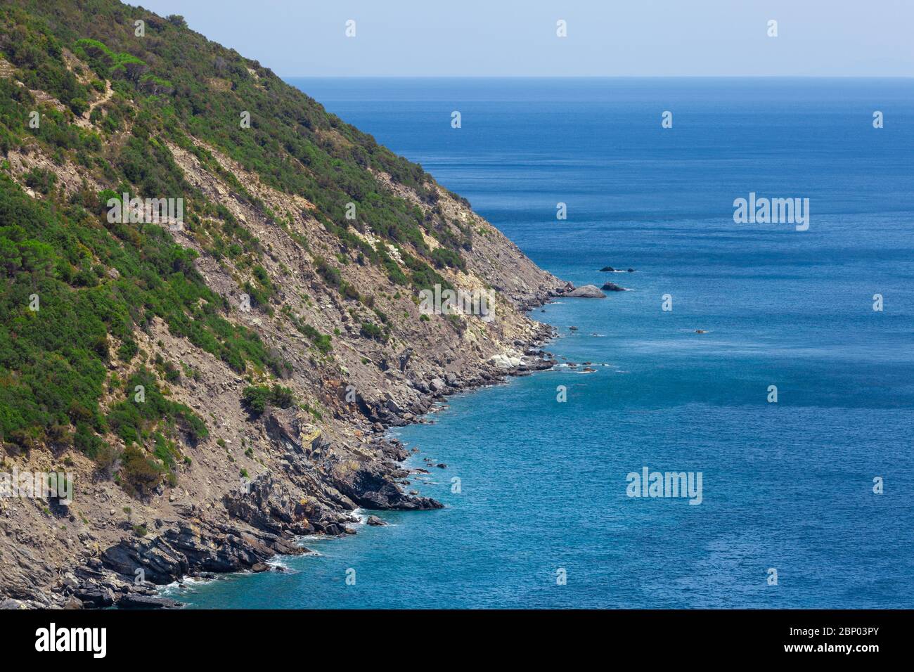 Coastline with cliff mountain and seashore view. Pitched rock face on ...
