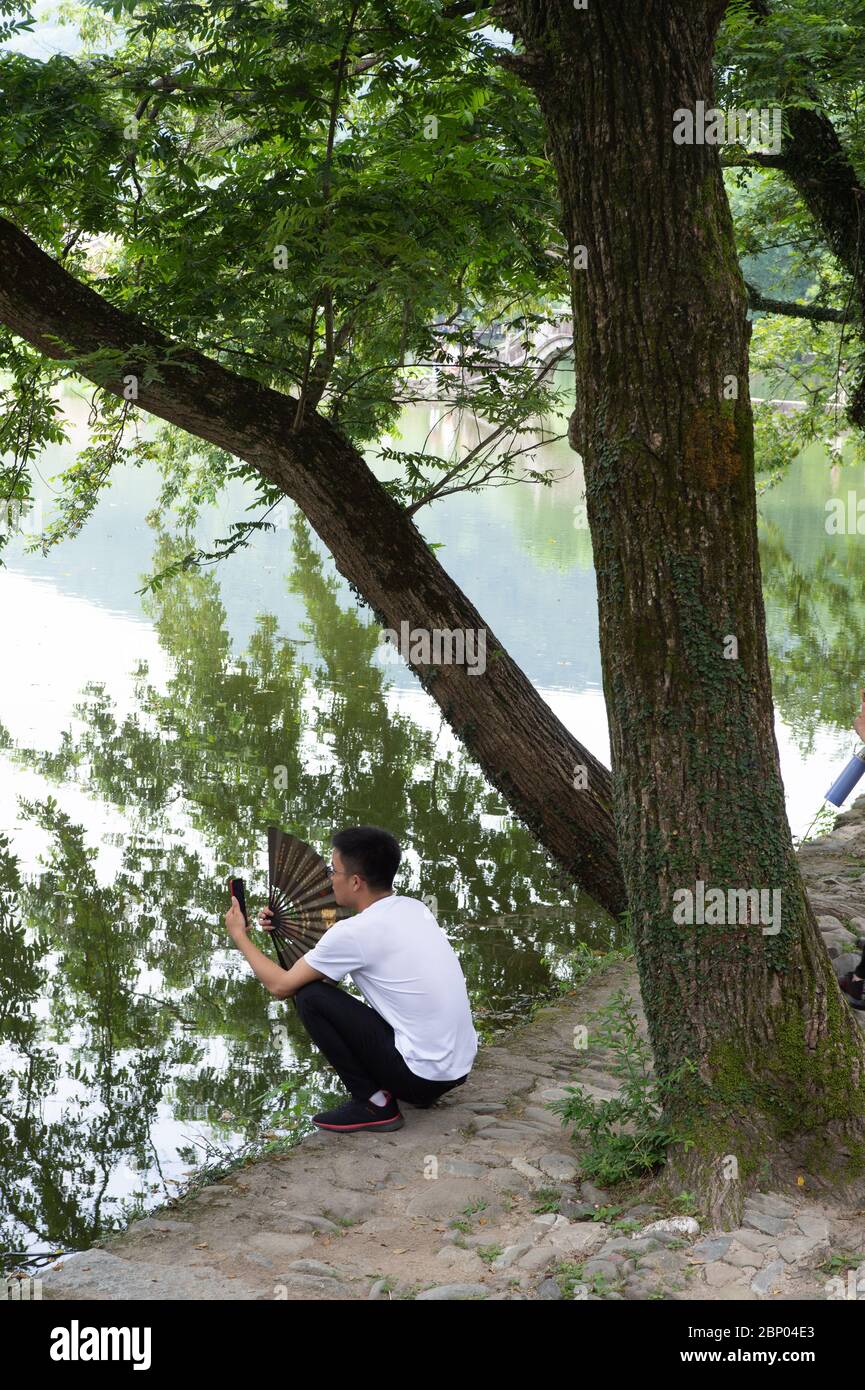 Man with fan hi-res stock photography and images - Alamy