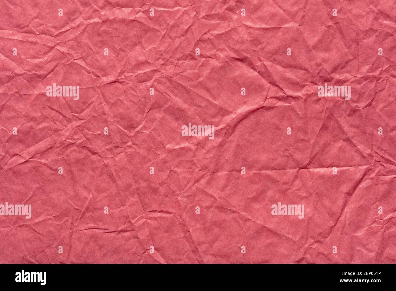 Crumpled paper background in saturated pink color as part of your ...